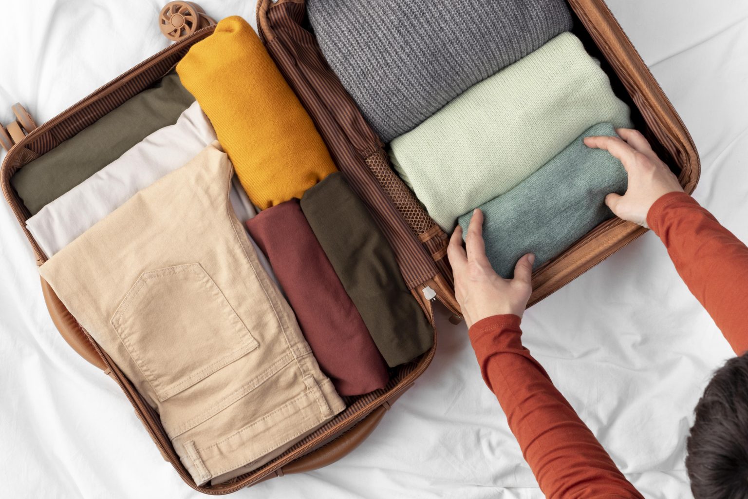 Roll, roll, roll, so you can pack extra stuff into your suitcase!